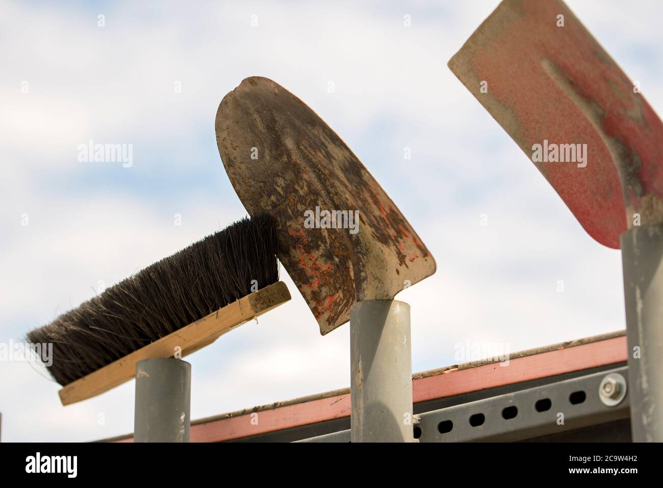 Tool road worker with broom, shovel and spade Stock Photo - Alamy