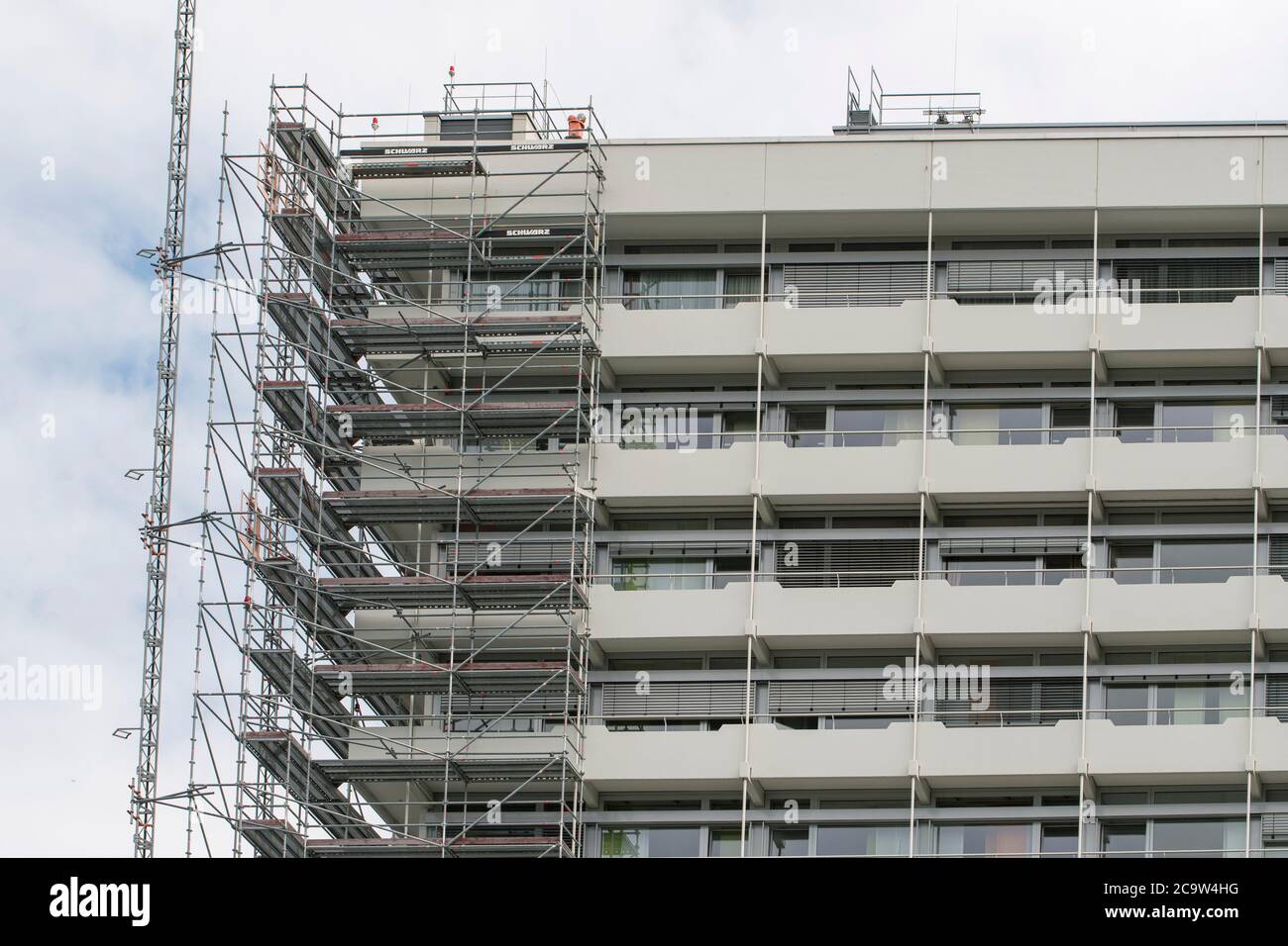 large tall building with scaffolding being renovated Stock Photo - Alamy