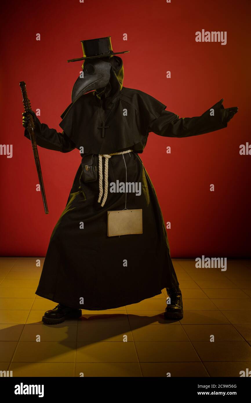 Actress woman in mask and costume of fictional fantasy character posing ...