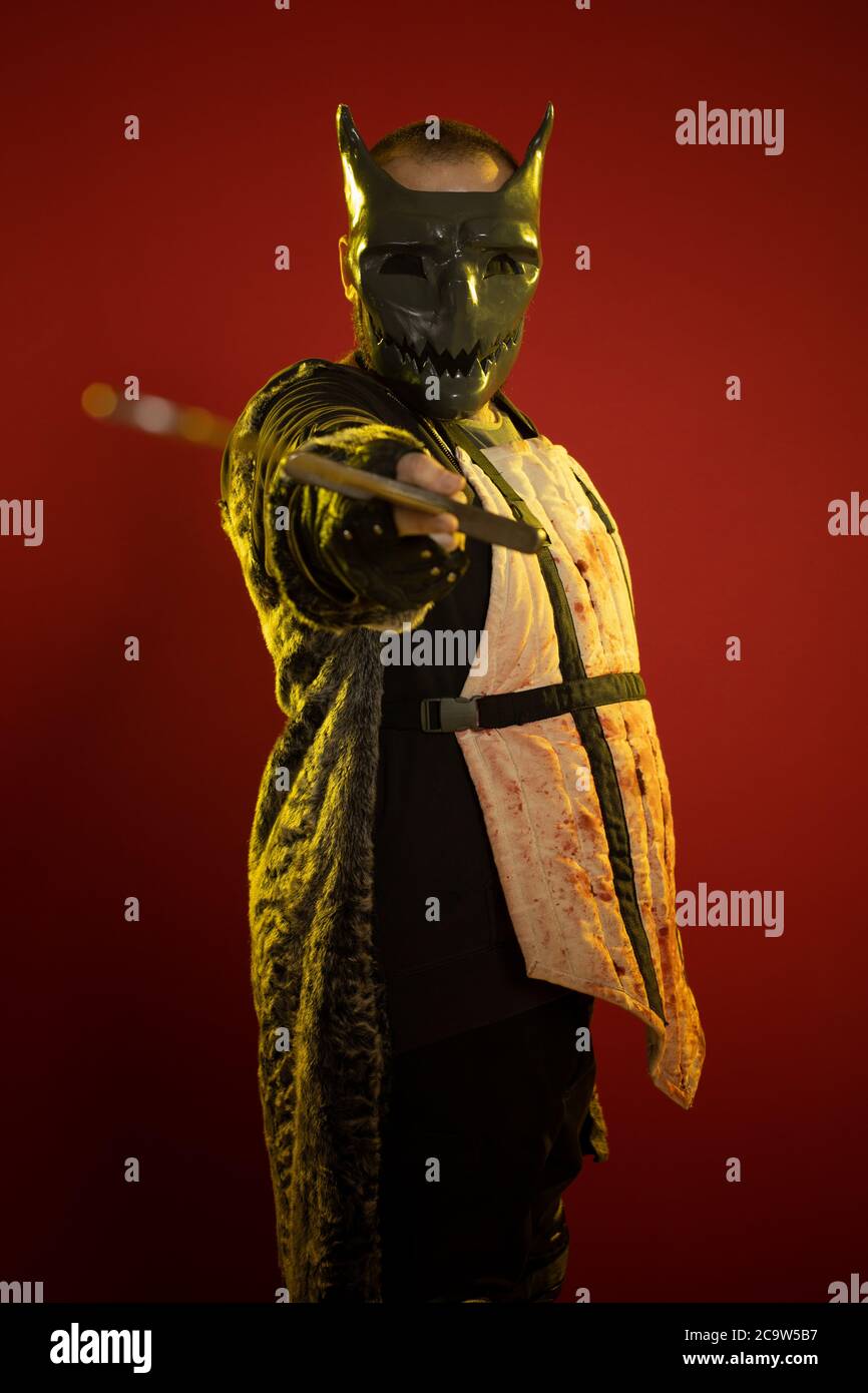 Actor a man in a mask and in costumes of fictional fantasy characters ...