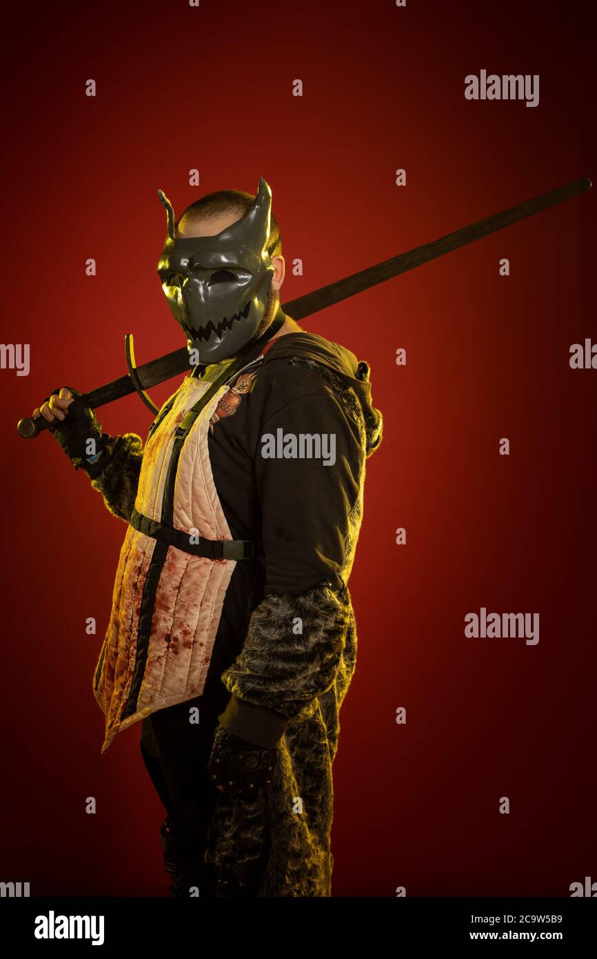 Actor a man in a mask and in costumes of fictional fantasy characters ...