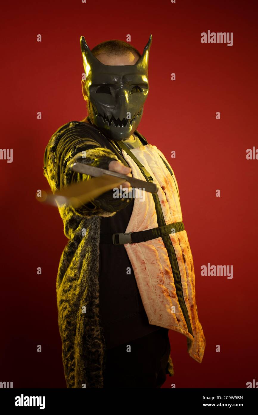Actor a man in a mask and in costumes of fictional fantasy characters ...