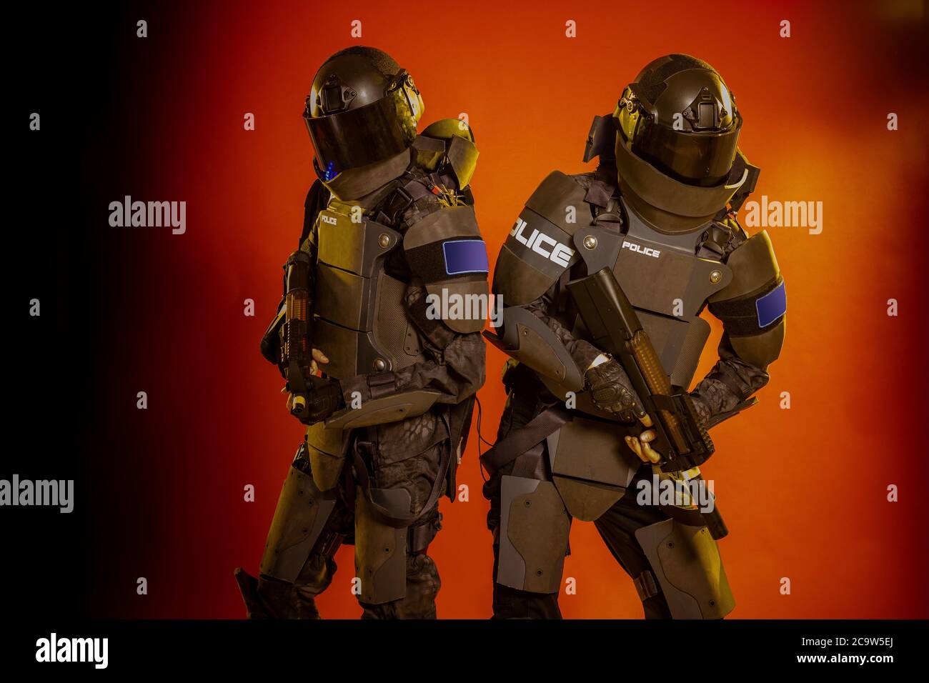 Actor man in a military helmet, mask and uniform with a gauss rifle in ...