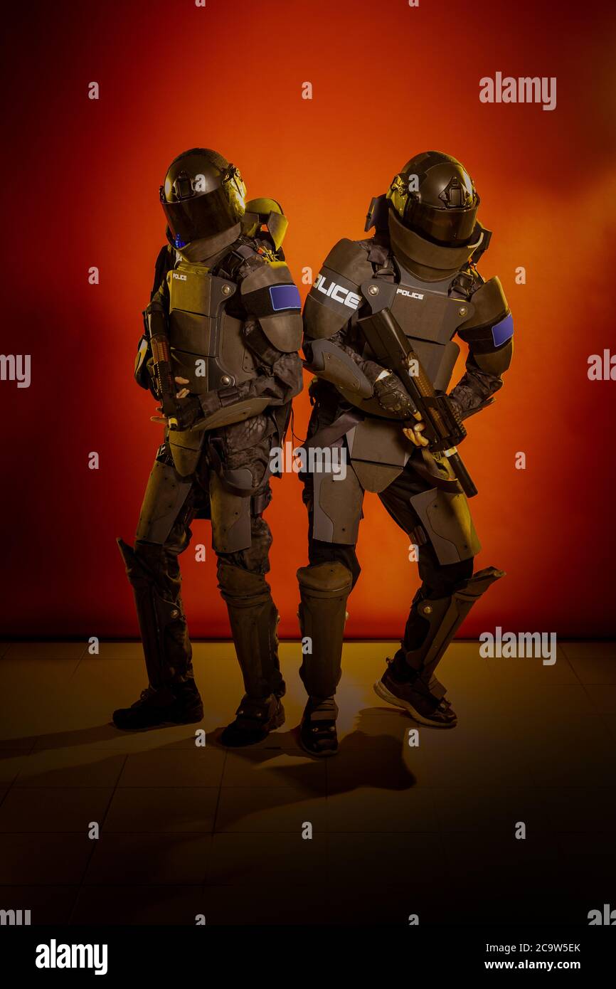 Actor man in a military helmet, mask and uniform with a gauss rifle in ...