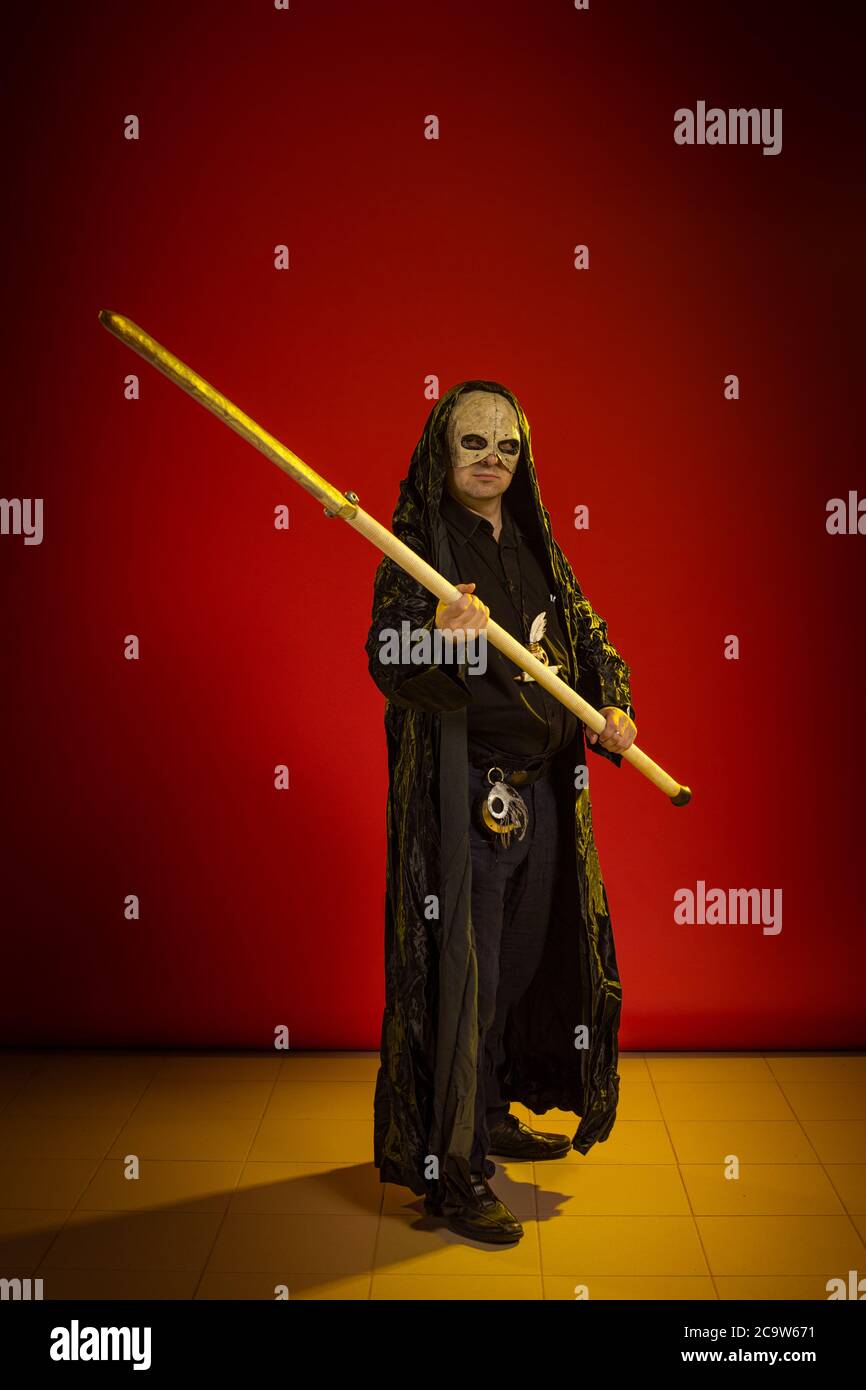 Actor a man in a mask and in costumes of fictional fantasy characters ...