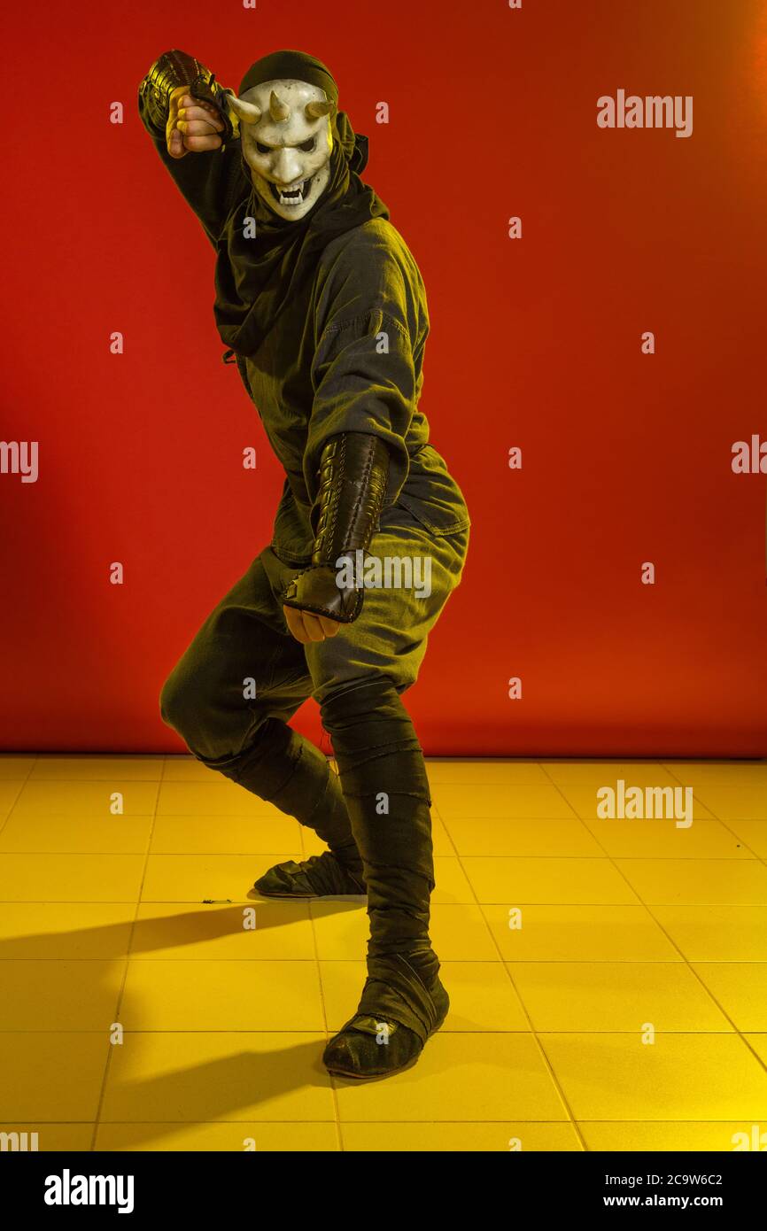 Actor a man in a mask and in costumes of fictional fantasy characters ...