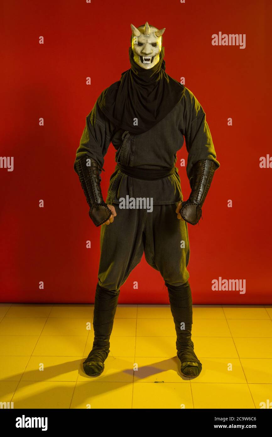 Actor a man in a mask and in costumes of fictional fantasy characters ...