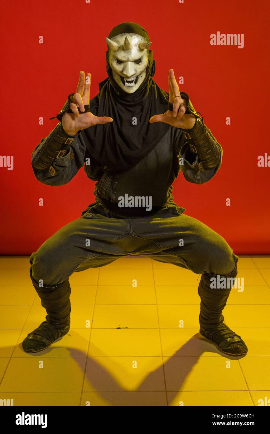 Actor a man in a mask and in costumes of fictional fantasy characters ...