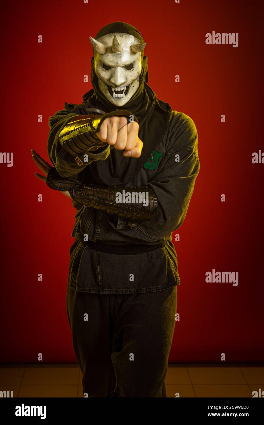 Actor a man in a mask and in costumes of fictional fantasy characters ...