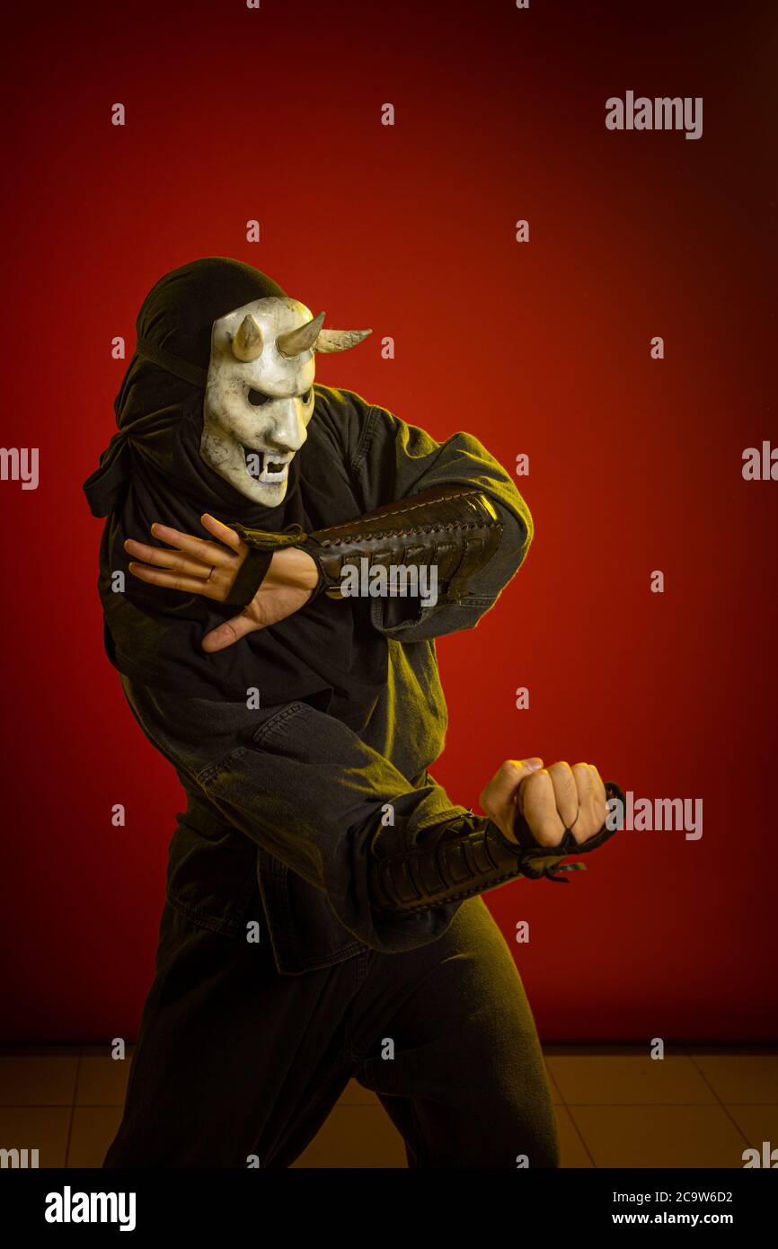 Actor a man in a mask and in costumes of fictional fantasy characters ...