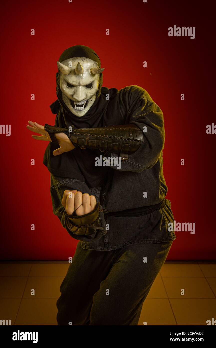 Actor a man in a mask and in costumes of fictional fantasy characters ...