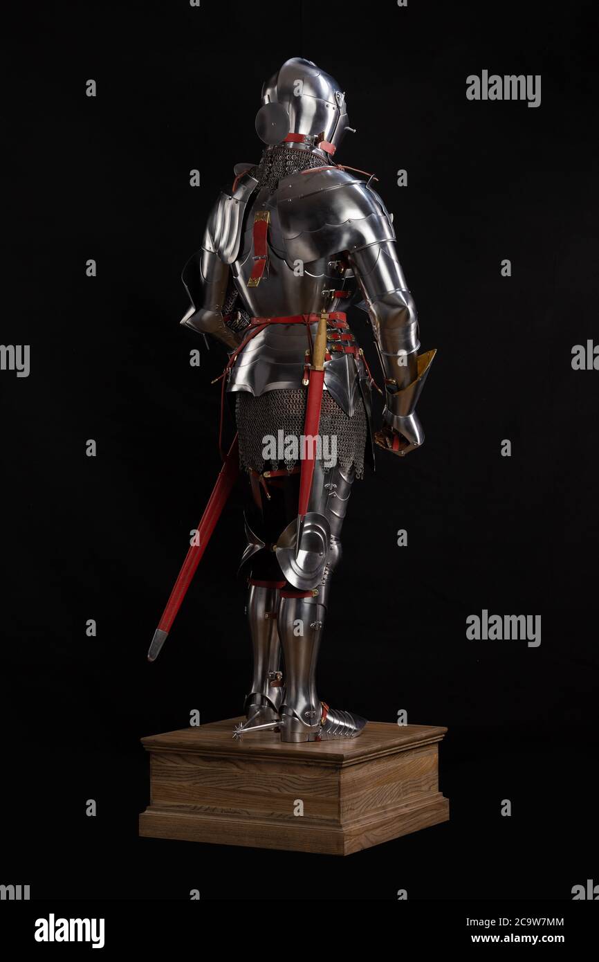 Mannequin man with a beard in a helmet and armor of a knight posing on ...
