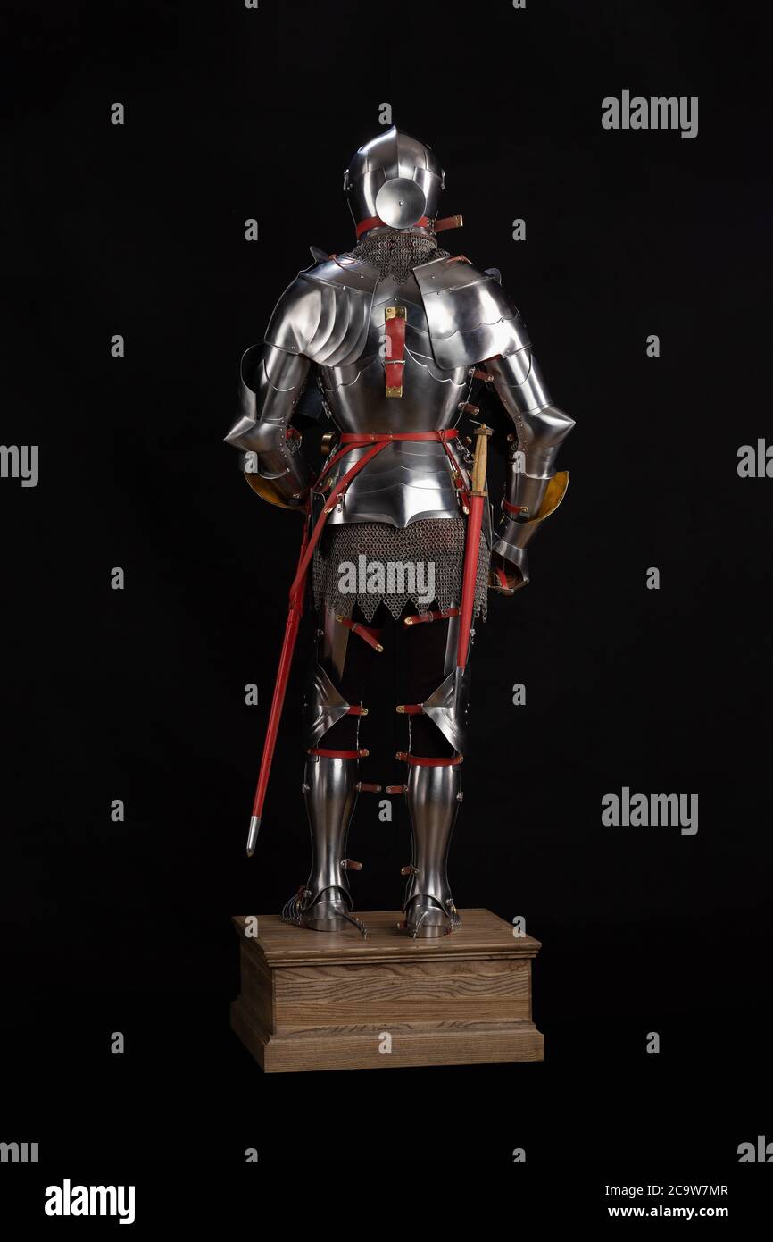 Mannequin man with a beard in a helmet and armor of a knight posing on ...
