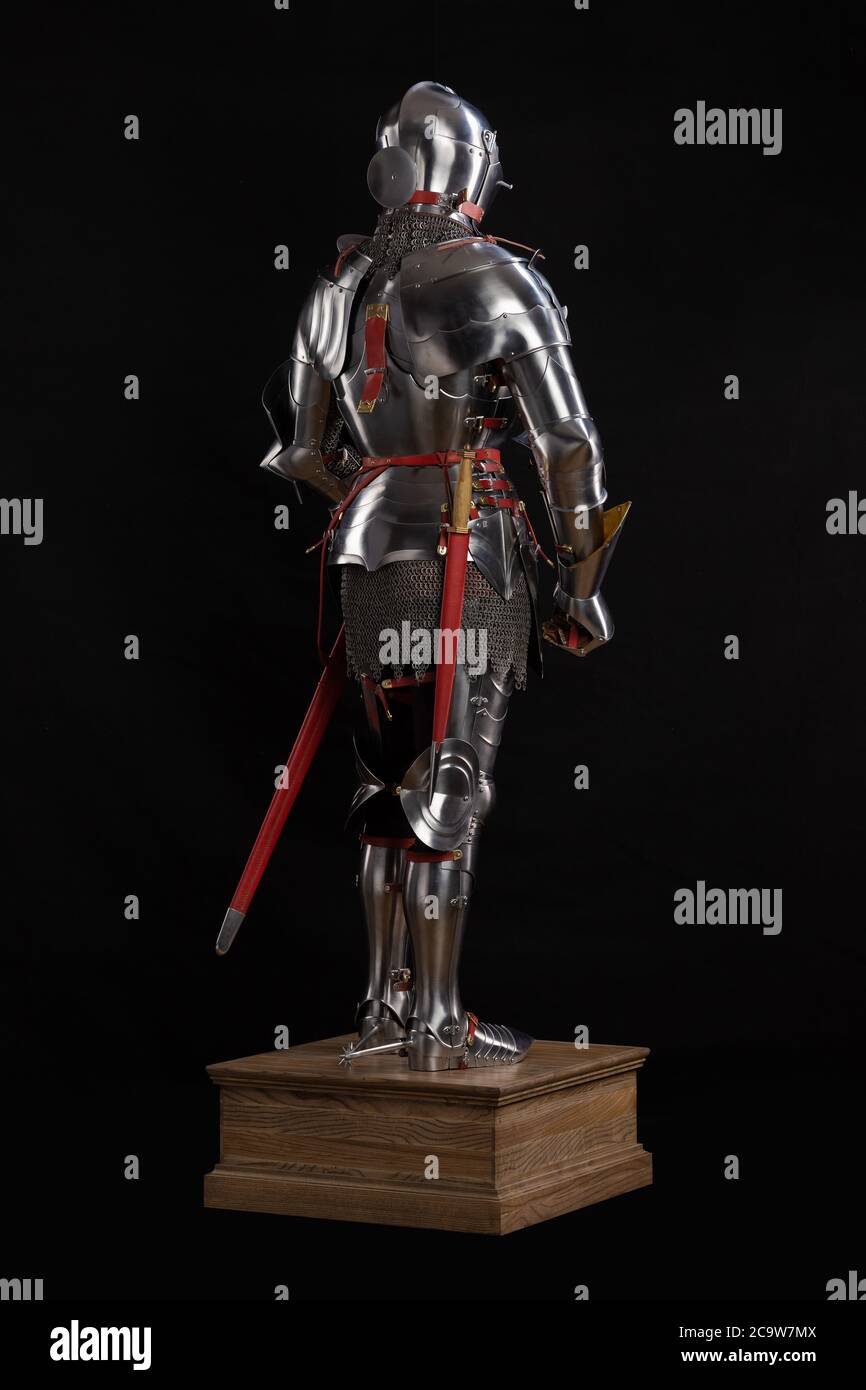 Mannequin man with a beard in a helmet and armor of a knight posing on ...