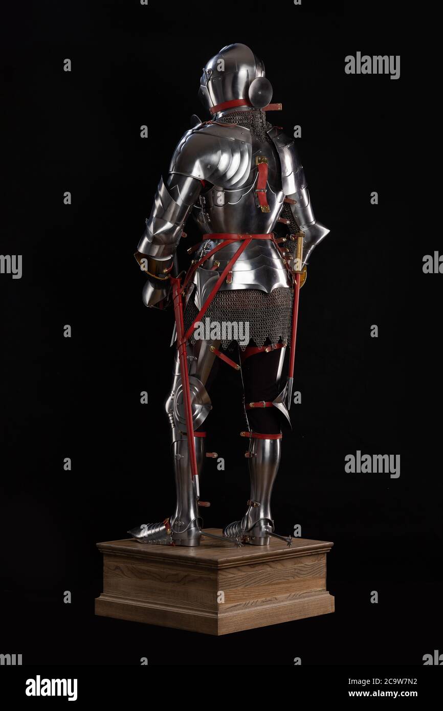Mannequin man with a beard in a helmet and armor of a knight posing on ...
