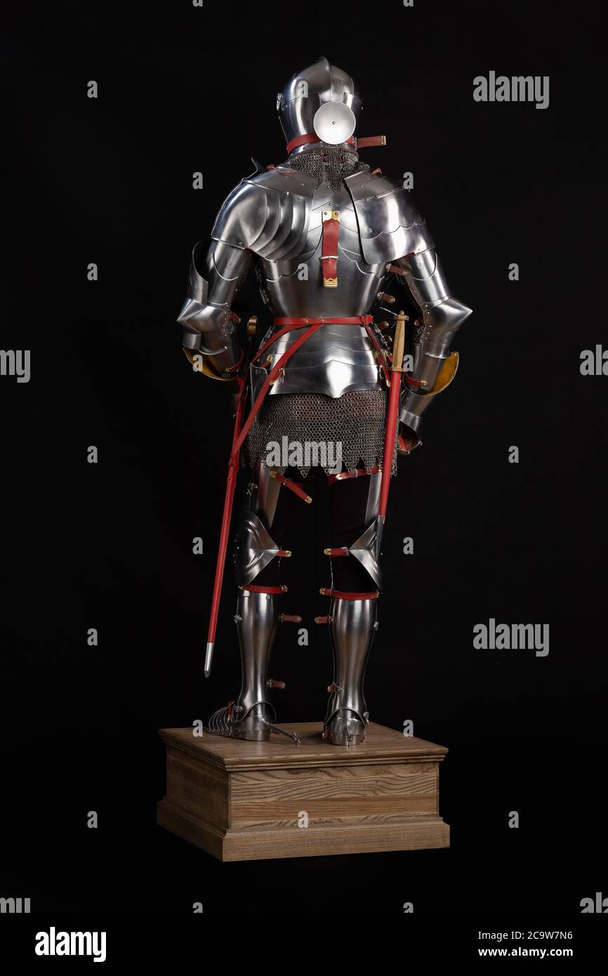 Mannequin man with a beard in a helmet and armor of a knight posing on ...