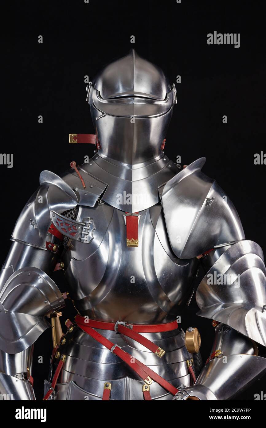 Mannequin man with a beard in a helmet and armor of a knight posing on ...