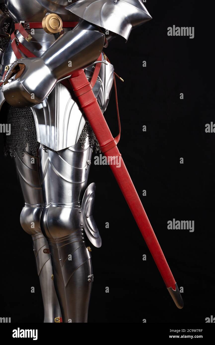 Mannequin man with a beard in a helmet and armor of a knight posing on ...