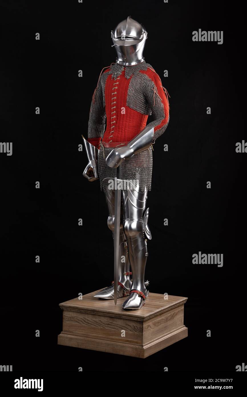 Mannequin man with a beard in a helmet and armor of a knight posing on ...