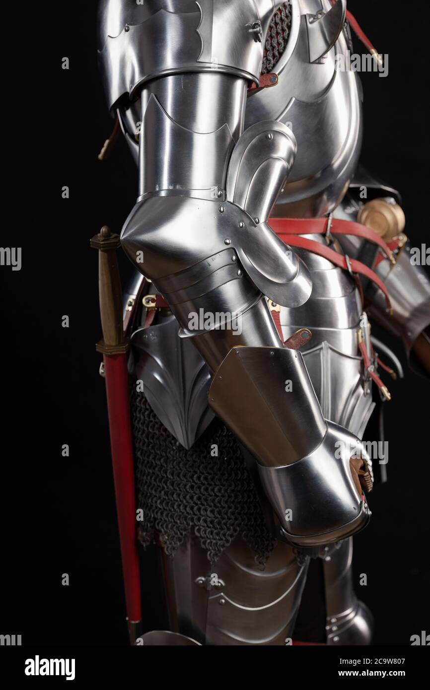 Mannequin man with a beard in a helmet and armor of a knight posing on ...