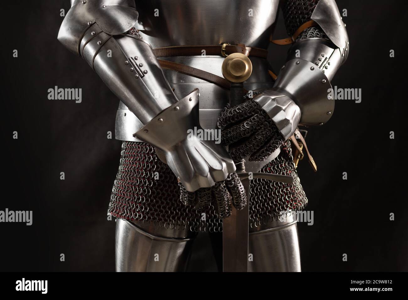 Mannequin man with a beard in a helmet and armor of a knight posing on ...