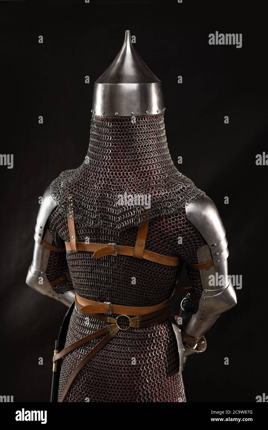 Mannequin man with a beard in a helmet and armor of a knight posing on ...