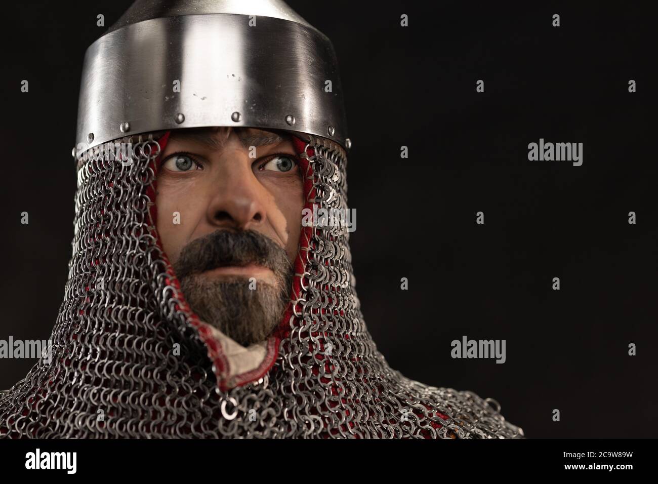 Mannequin man with a beard in a helmet and armor of a knight posing on ...
