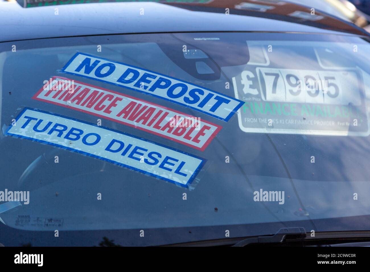 the price stickers on the inside of a car windscreen that is for sale ...