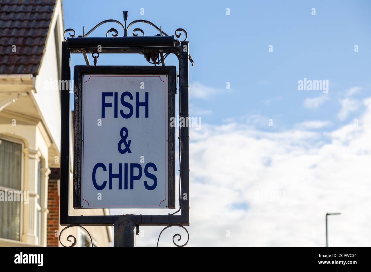 A sign outside a Fish and chips shop or chippy reading Fish and Chips ...