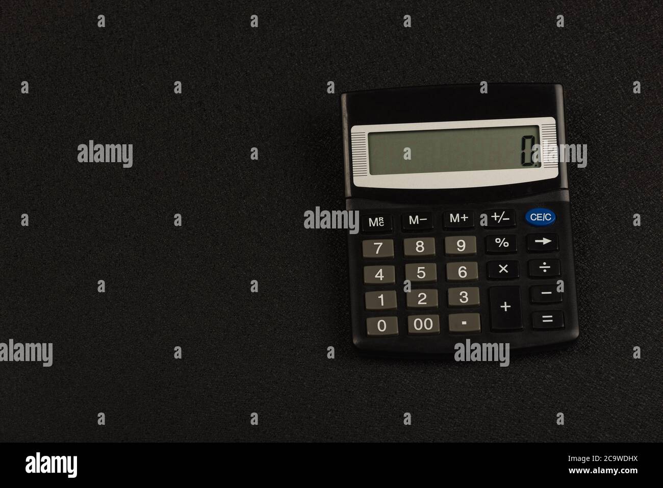 Calculator on black background. Top view. Calculations, accounting ...