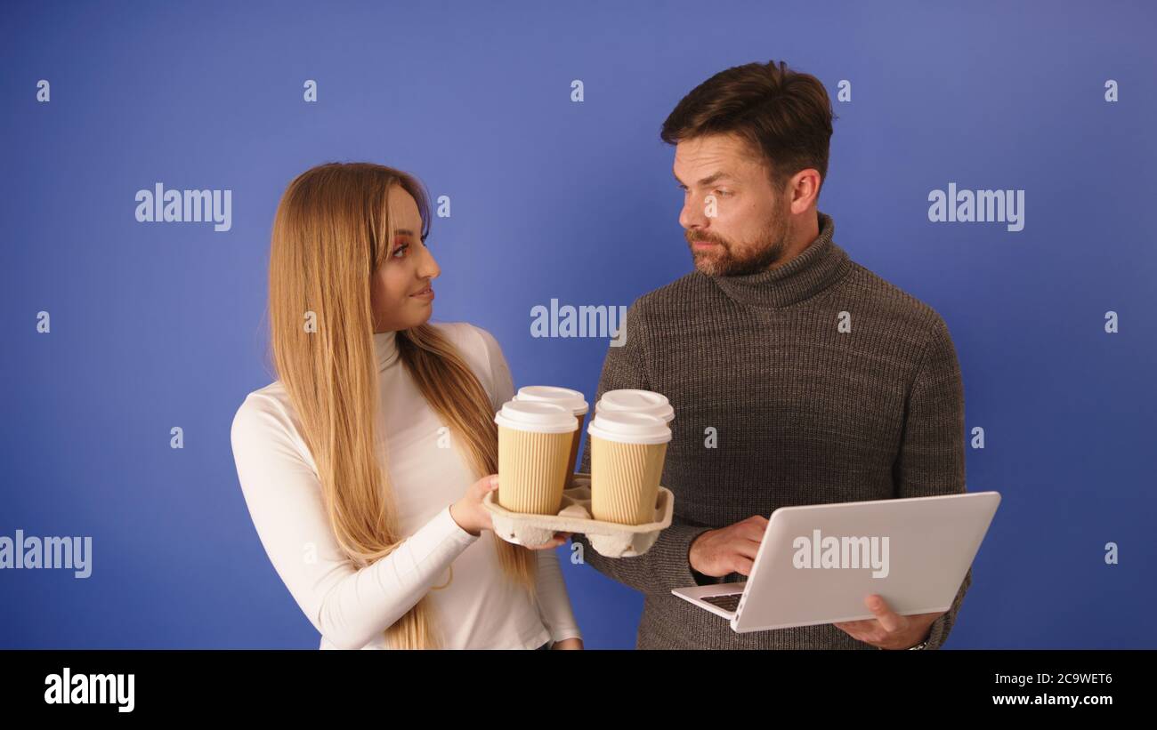 Take a break concept. Woman bringing take away coffee cups to a ...