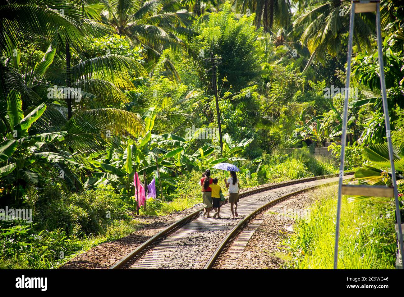 The natives family walking on railway tracks in Sri Lanka Stock Photo ...
