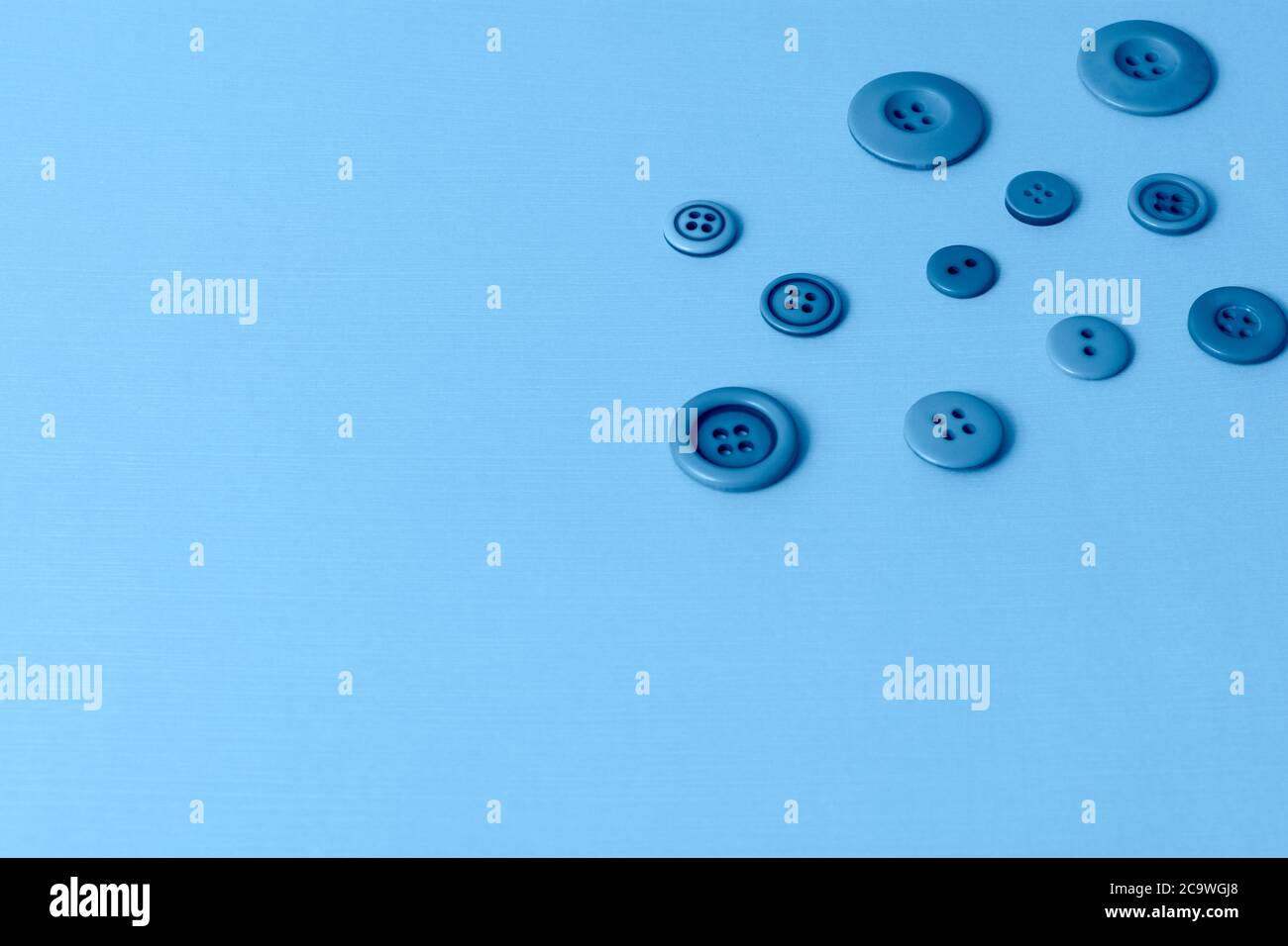 Blue buttons over blue background with copy space Stock Photo - Alamy