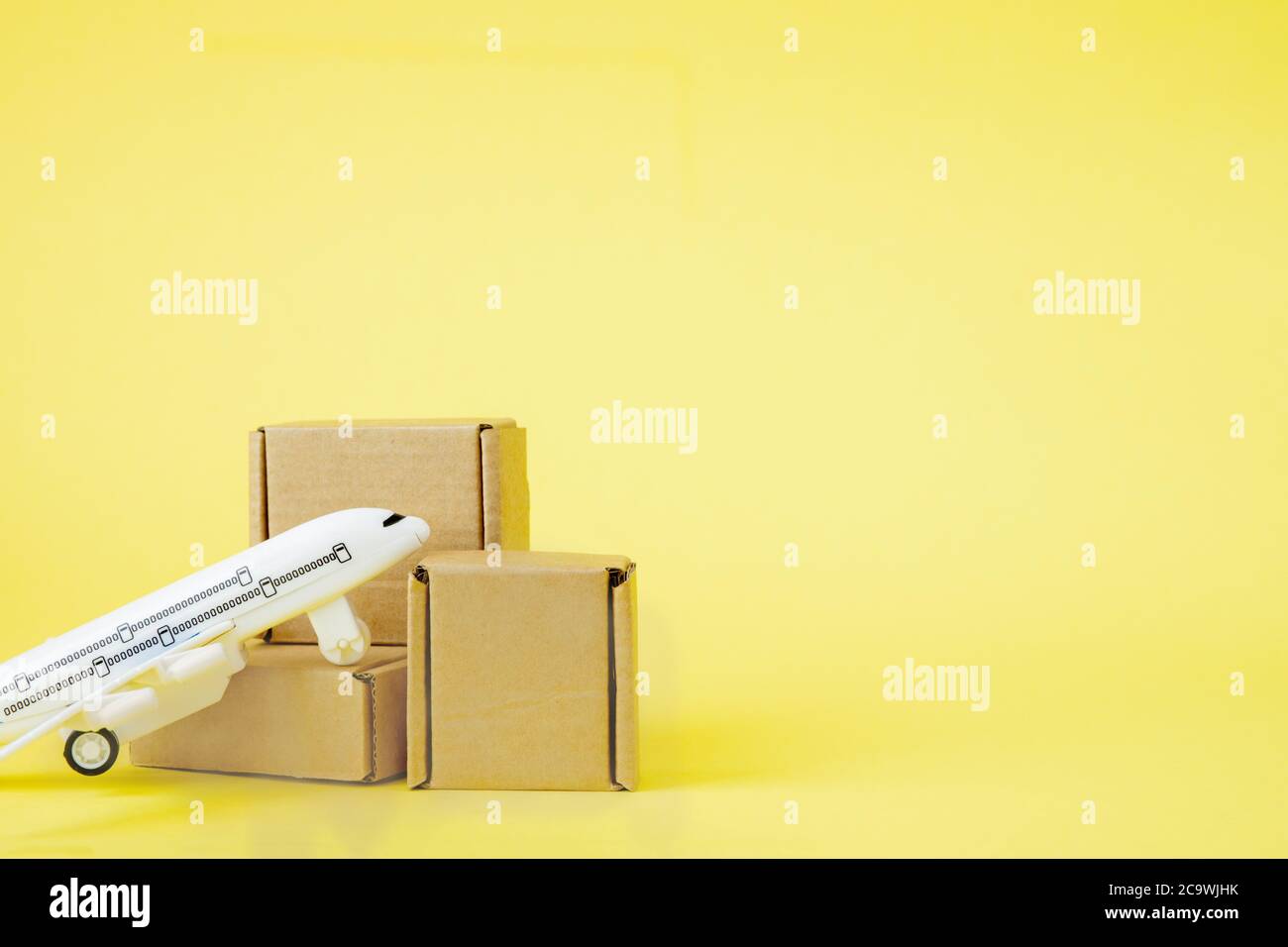 Airplane and stack of cardboard boxes. concept of air cargo and parcels ...