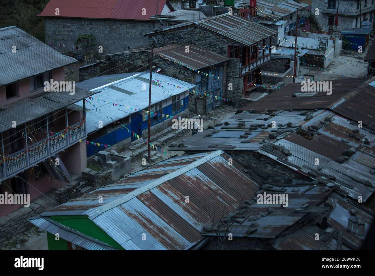 View over the mounatin village Dharapani with prayer flags along ...