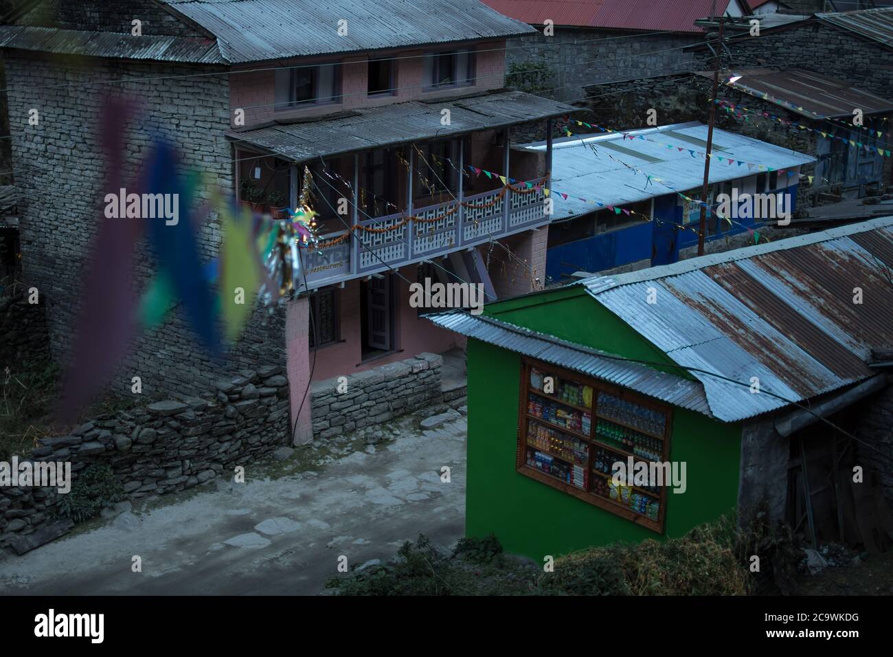 View over the mounatin village Dharapani with prayer flags along ...