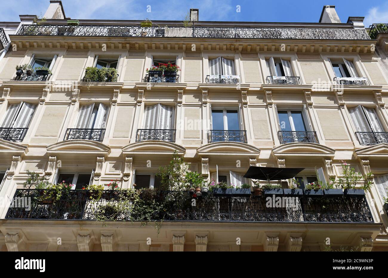Traditional French house with typical balconies and windows. Paris ...