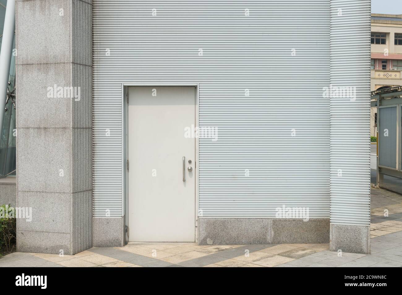 sidewalk by street wall & door Stock Photo - Alamy