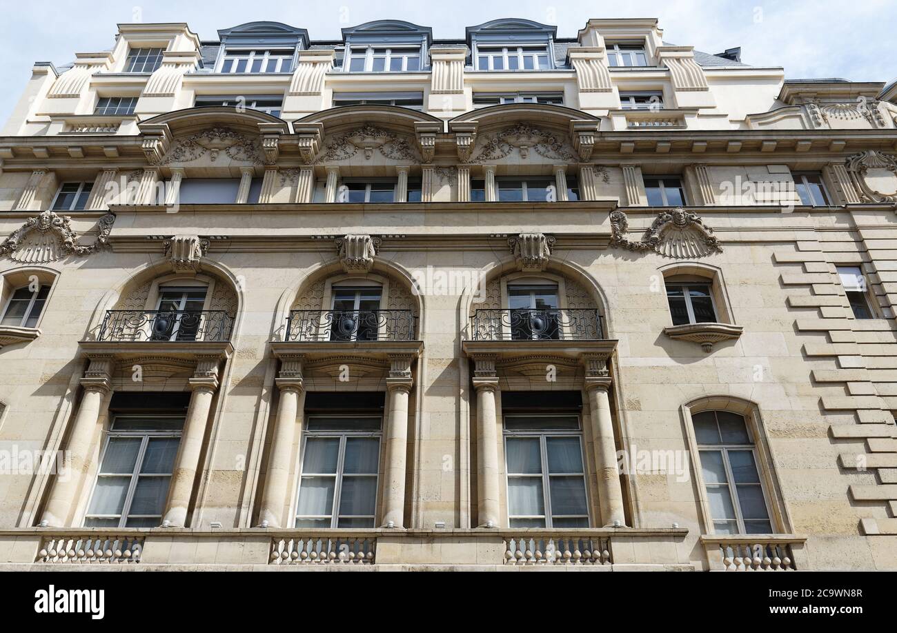 Traditional French house with typical balconies and windows. Paris ...