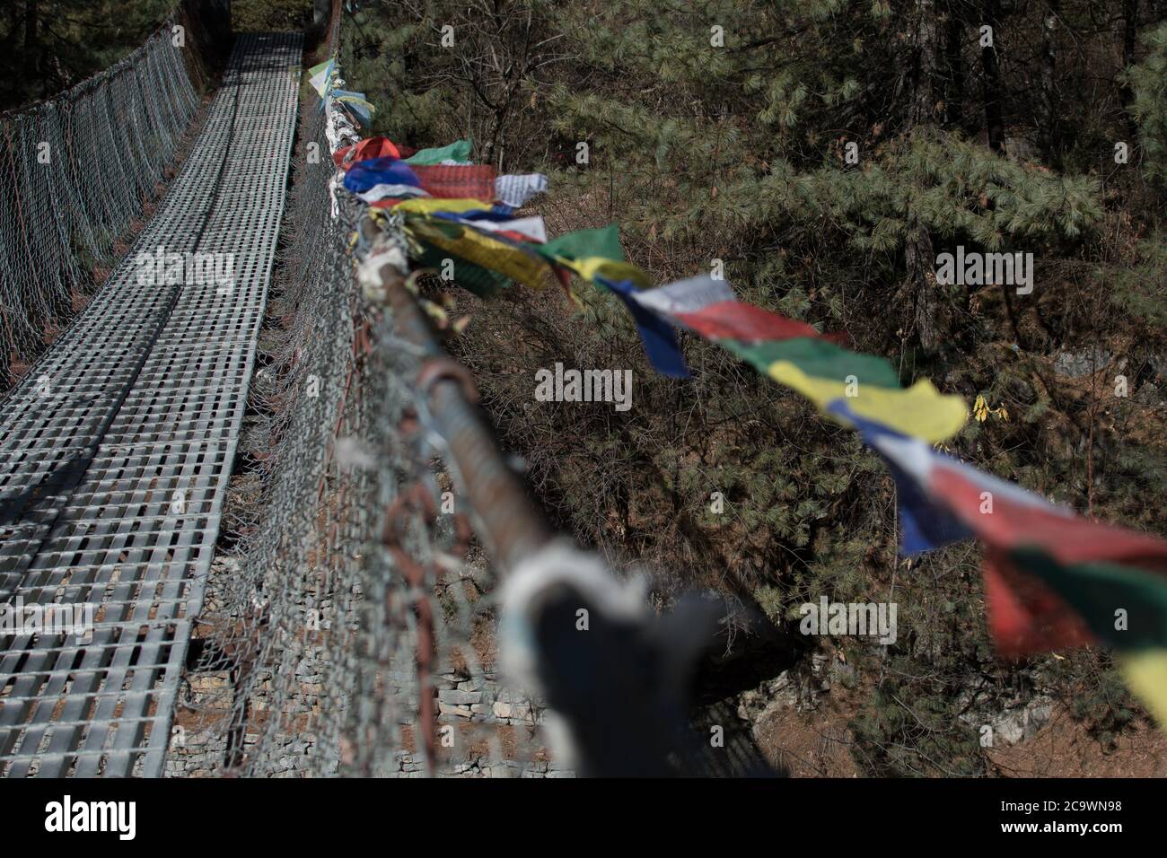 Trekking Annapurna circuit, suspension bridge with buddhist prayer ...