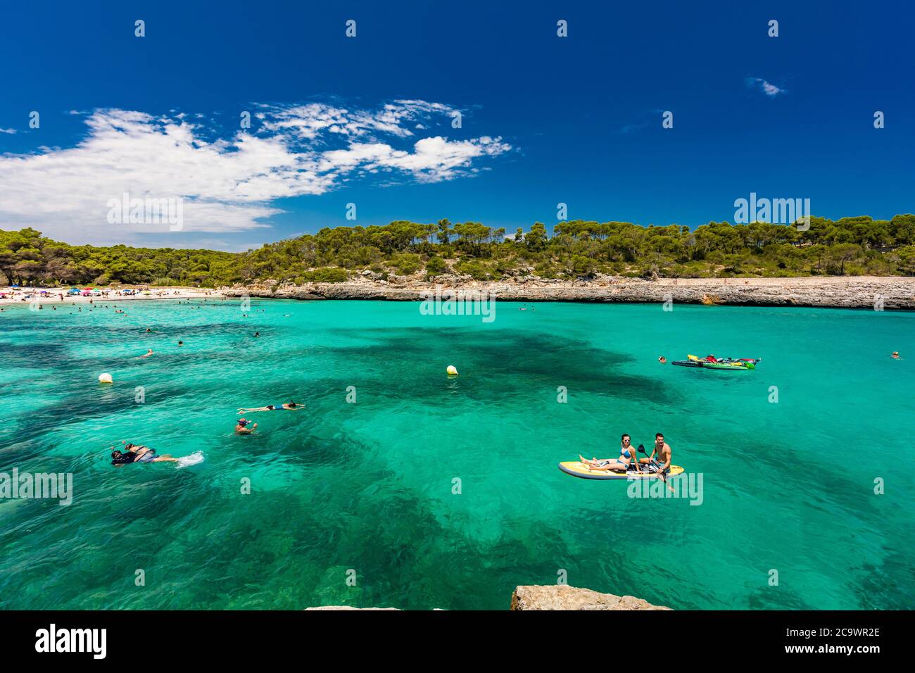 CALA MONDRAGO, Majorka, Spain, 24 July 2020 - People enjoy famous beach ...