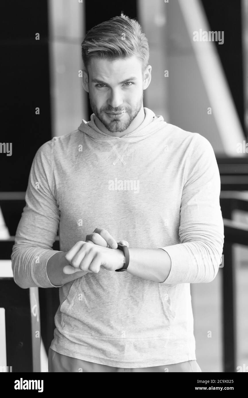 Bring cellular connectivity to sport watch arena. Athletic man check ...