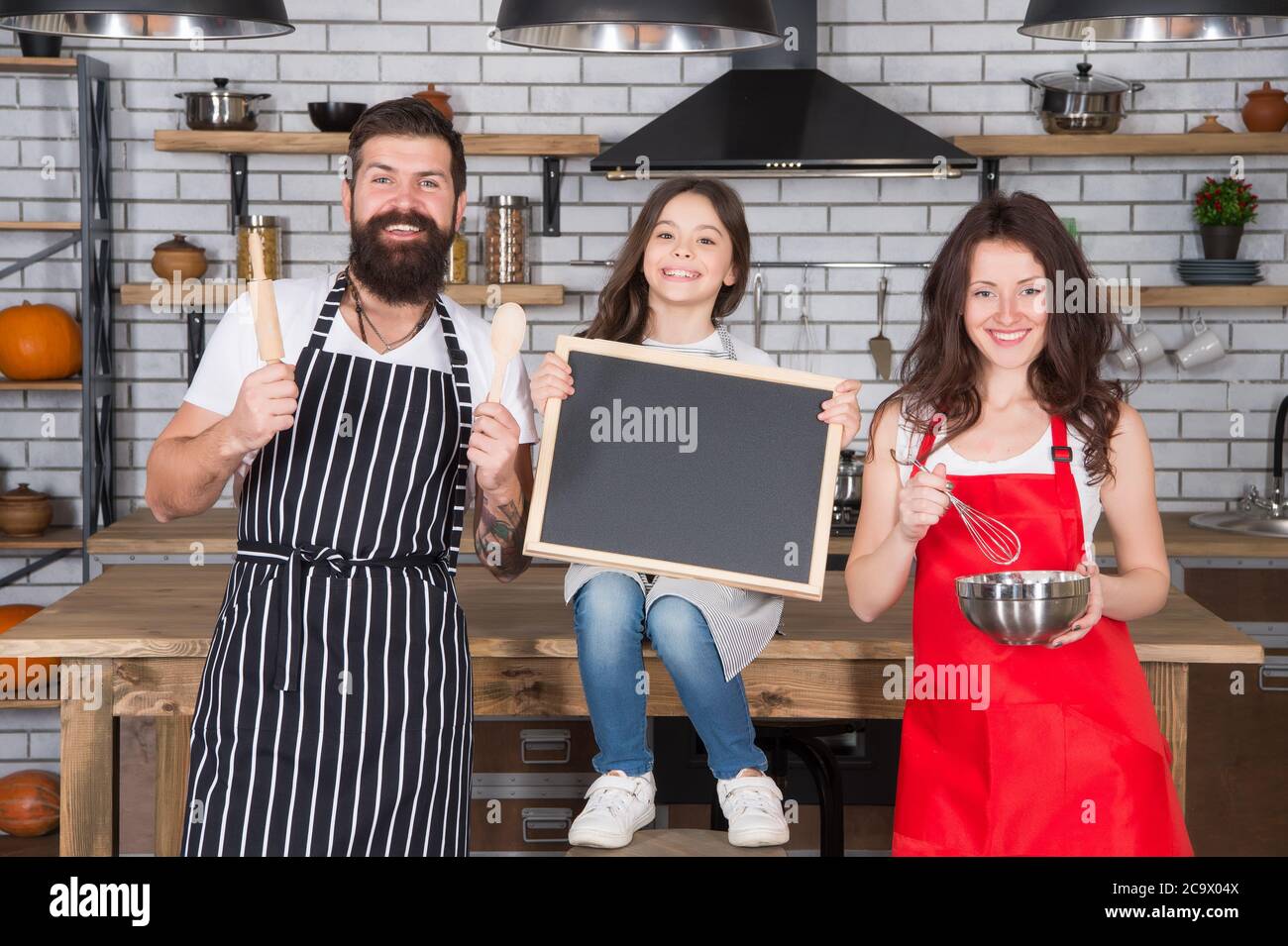 Parents mom dad and daughter chalkboard at kitchen, cook with love ...