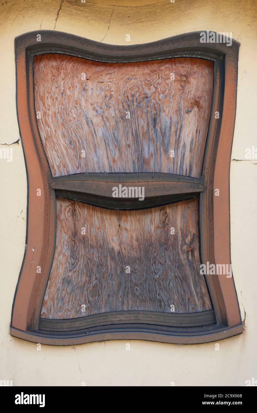 Fantasy fairy-tale window with curved old wood framework on a yellow ...