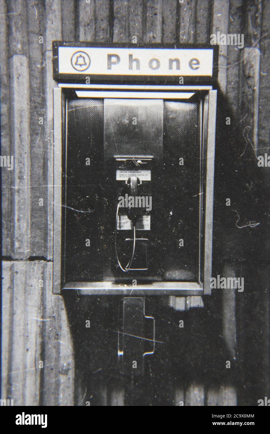 Fine 70s vintage black and white lifestyle photography of a public pay ...