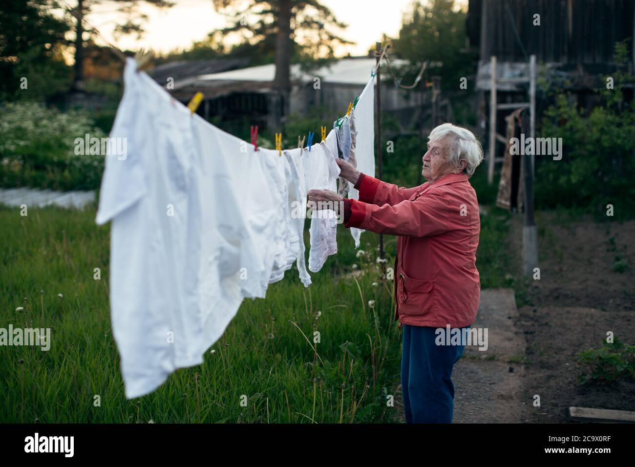 Old woman stands hi-res stock photography and images - Alamy