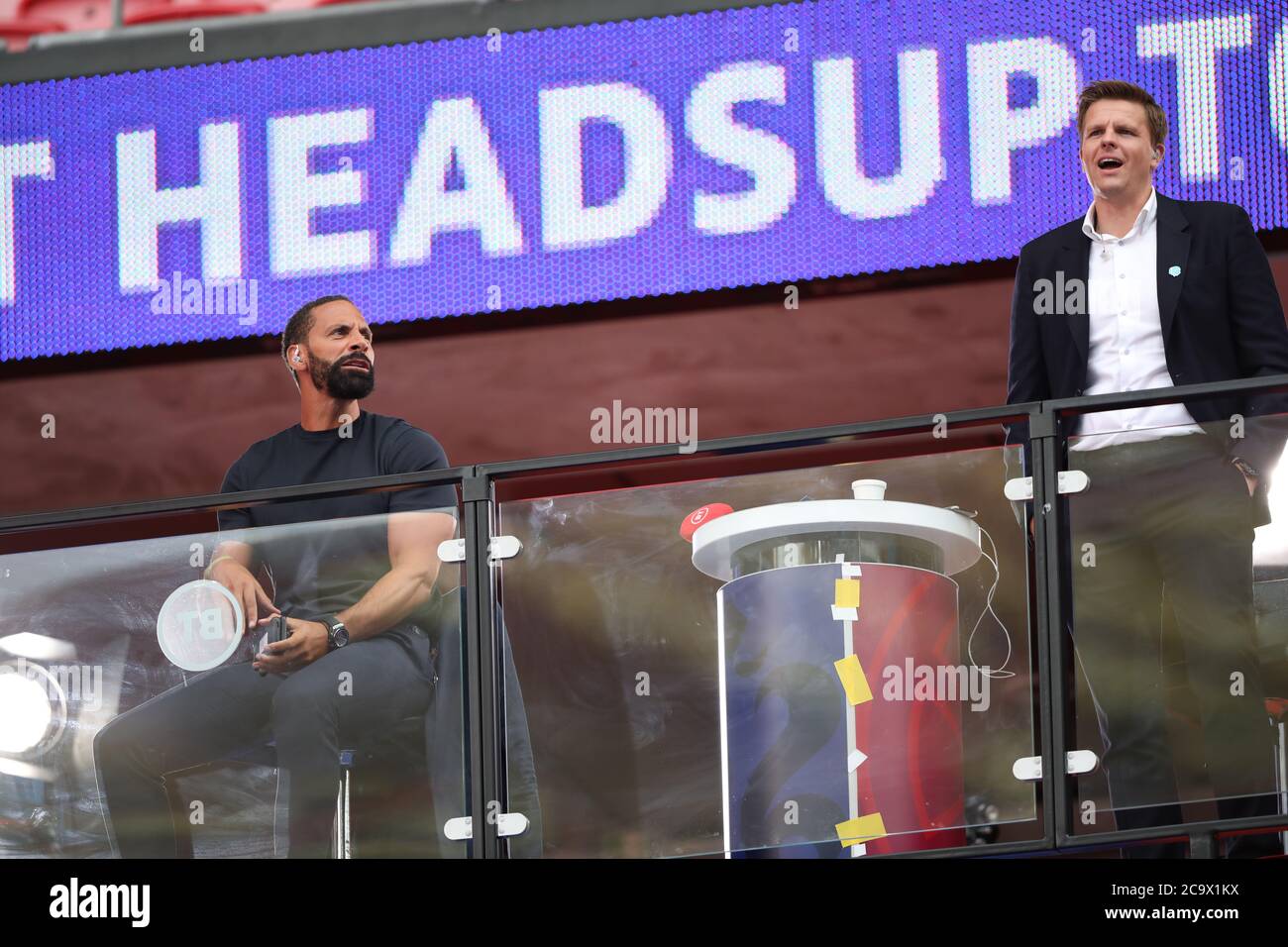 Wembley, UK. 01st Aug, 2020. Rio Ferdinand and Jake Humphrey working ...