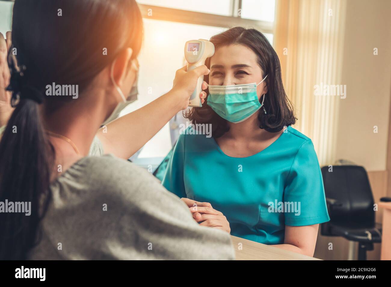 Doctor at hotel front desk hi-res stock photography and images - Alamy
