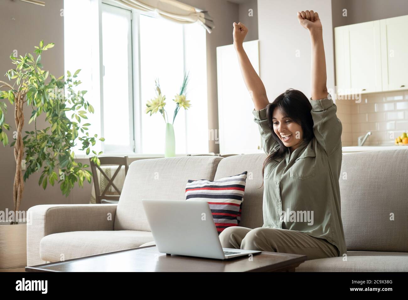 Excited woman computer home hi-res stock photography and images - Alamy