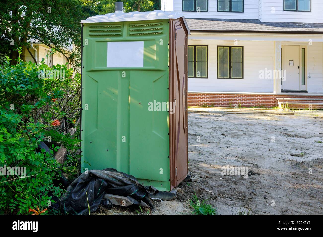 Portable restroom on house under construction in a new house Stock ...